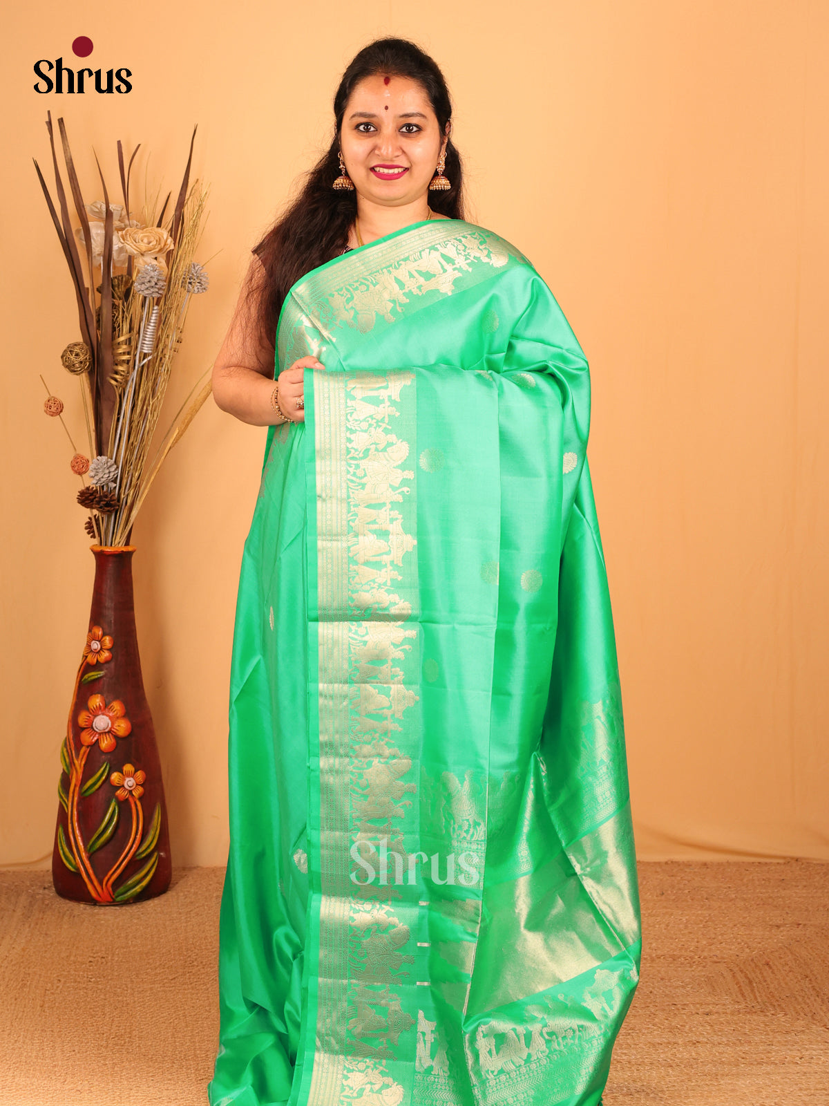 Shop Teal Green Soft Silk Saree With Baraat Motif Border at Shrus