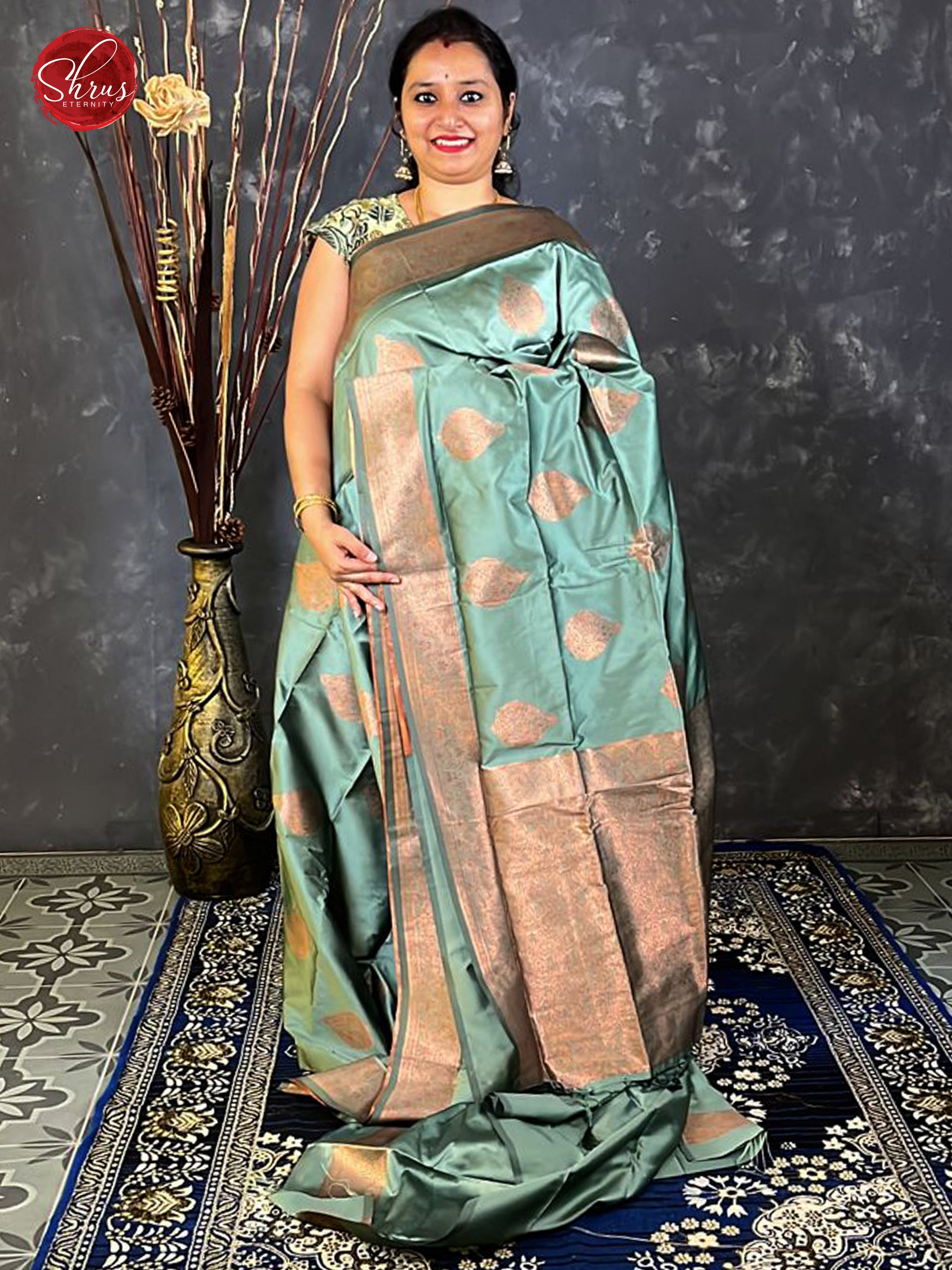 Green(Single tone)- Semi Khatan with zari woven floral motifs on the b